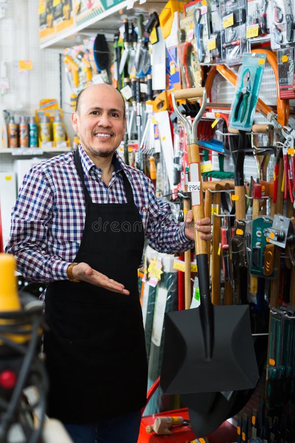 Salesman with Garden Tools in Store Stock Image - Image of consumerism ...
