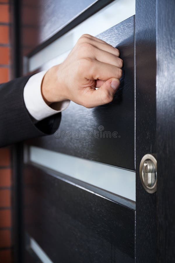 Angry Man Knocking on Red Door Stock Image - Image of male, hand: 9871051