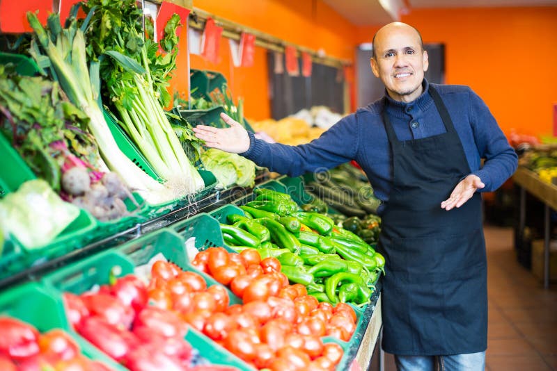 Salesman Posing Near Different Vegetables Stock Photo - Image of ...