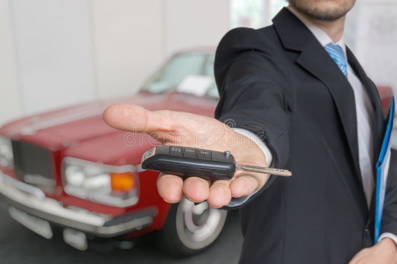 Salesman is Selling a New Car and Passing Keys Stock Image - Image of ...