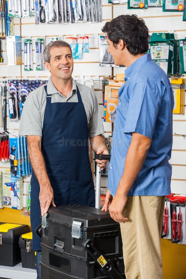 Salesman Showing Tool Case To Customer in Store Stock Image - Image of ...