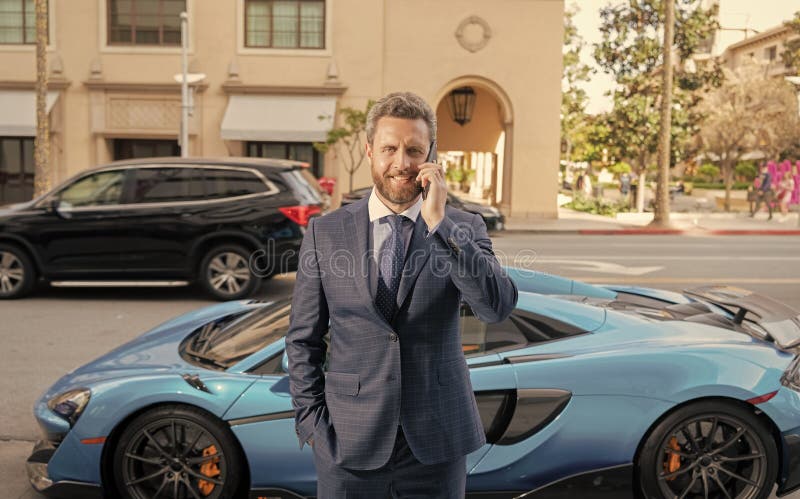Salesman Speaking on Mobile Phone. Rich Guy Rent Car Stock Photo ...