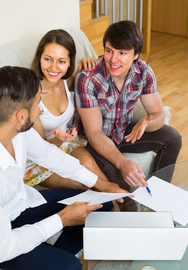 Salesman and Young Couple at Home Stock Image - Image of home ...