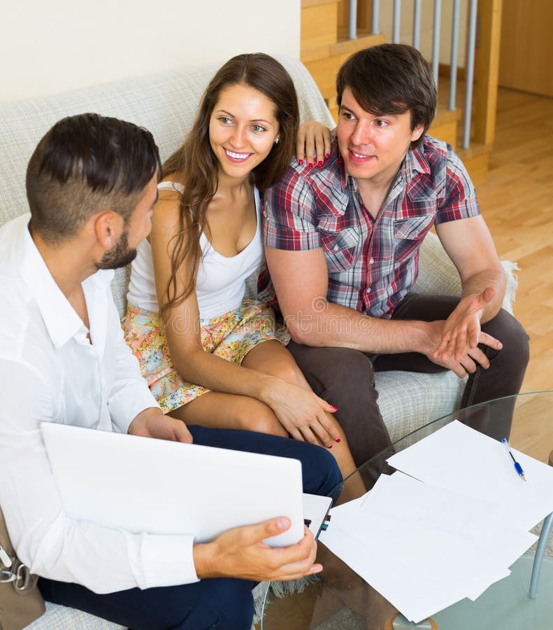 Salesman and Young Couple at Home Stock Image - Image of consultant ...