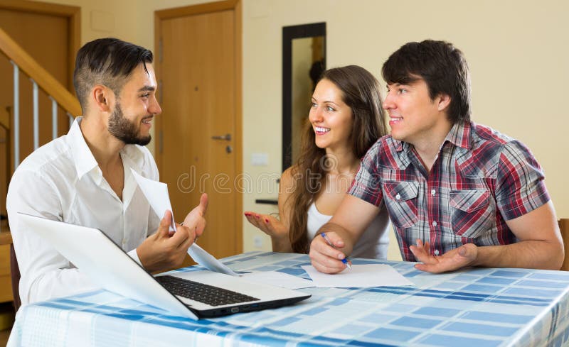 Salesman and Young Couple at Home Stock Image - Image of apartment ...
