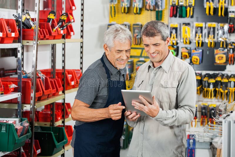 Salesperson and Customer Using Tablet Computer Stock Image - Image of ...