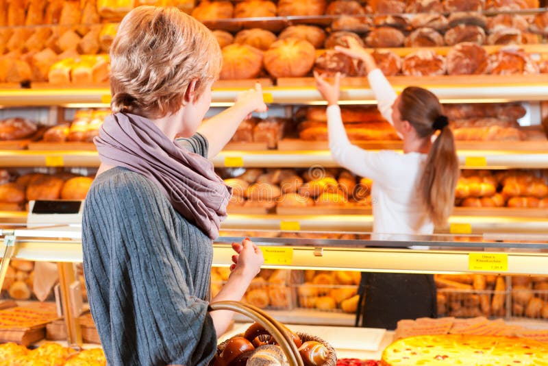 Salesperson with Female Customer in Bakery Stock Image - Image of ...