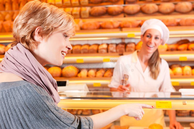 Salesperson with Female Customer in Bakery Stock Image - Image of ...