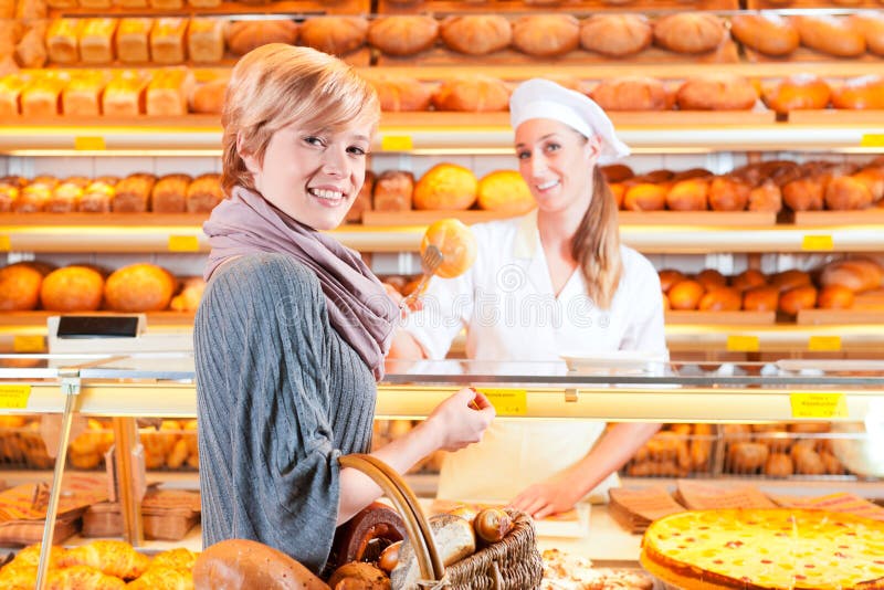 Salesperson with Female Customer in Bakery Stock Image - Image of ...
