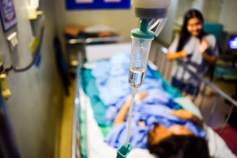 Saline IV drip and patient stock photo. Image of emergency - 71669418