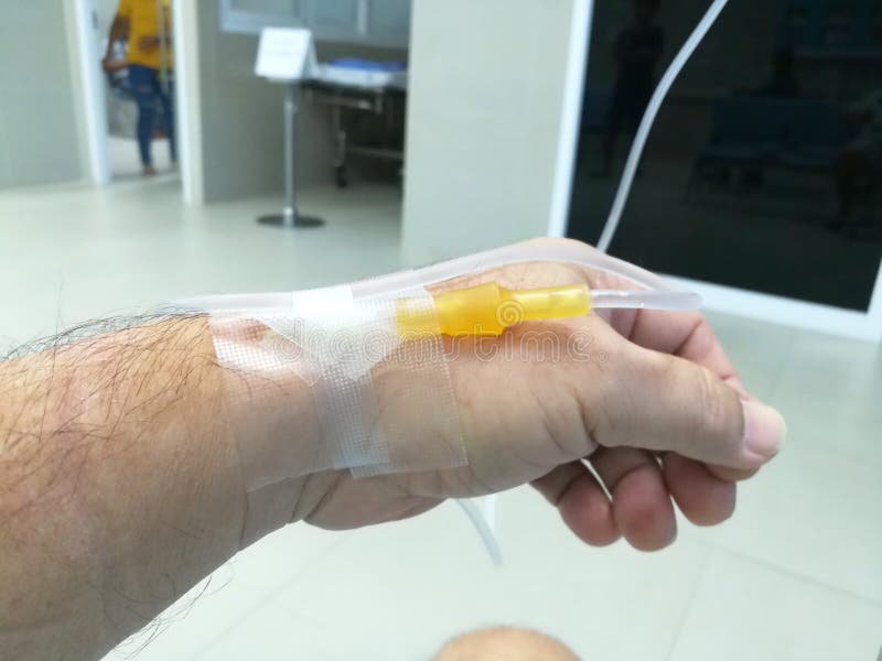 Saline Solution Line on Man Hand in Hospital. the Patient Get Saline ... Saline Solution Line on Man Hand in Hospital. the Patient Get Saline ...
