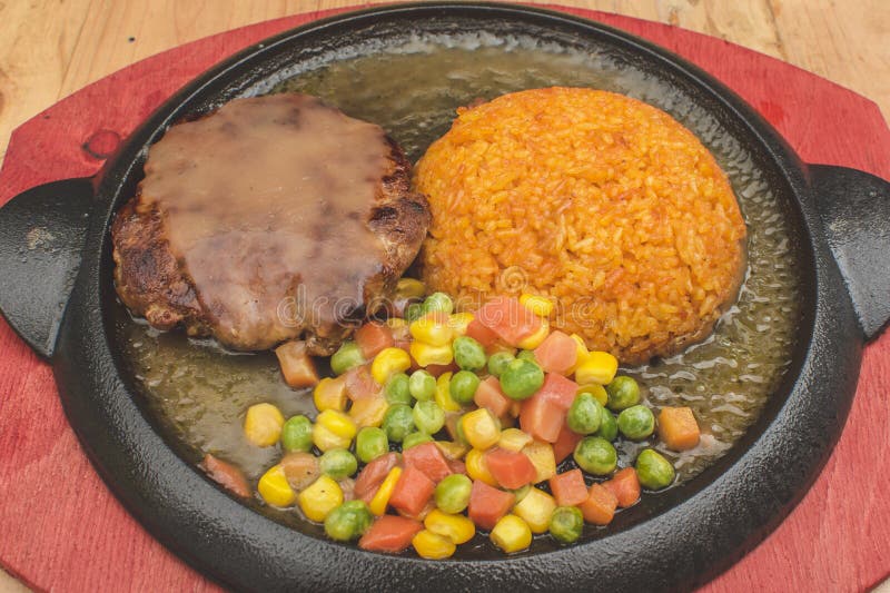 Salisbury Steak, Served with Mixed Vegetables and Fried Java Rice on a ...