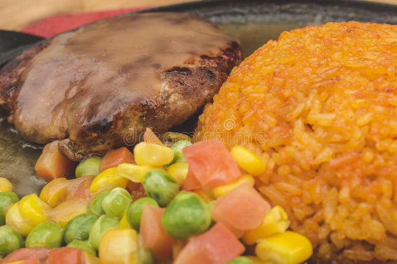 Salisbury Steak, Served with Mixed Vegetables and Fried Java Rice on a ...