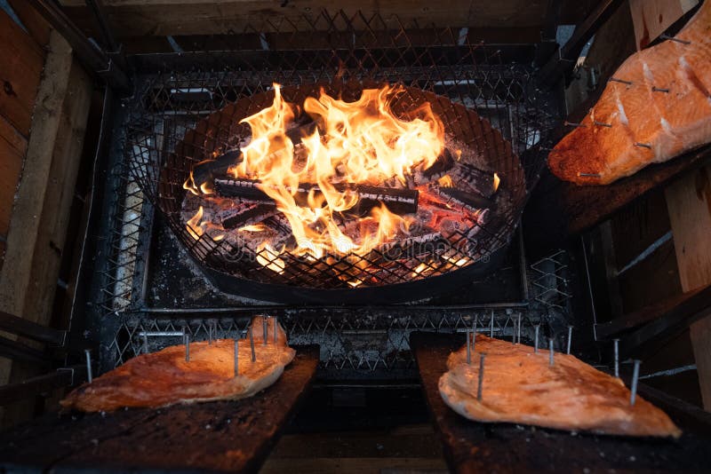 Salmon Being Smoked by an Open Wood Fire Stock Photo - Image of cook ...