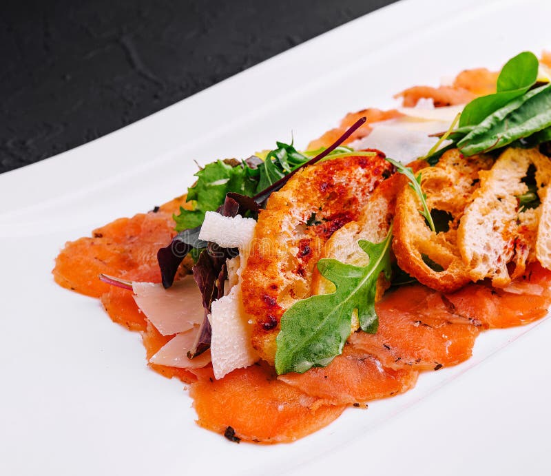 Salmon Carpaccio Served with Toast on Plate Stock Image - Image of ...