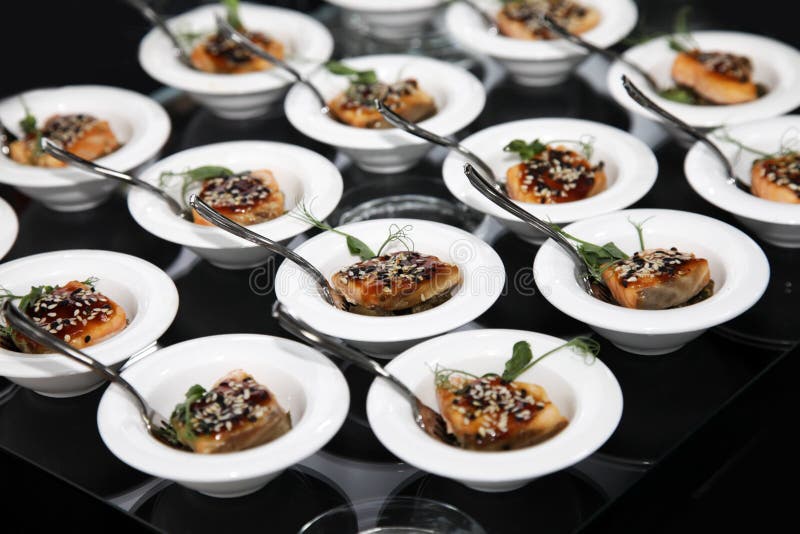 Salmon Filet with Tyriaki Sauce in a Small Plate on a Buffet Stock ...