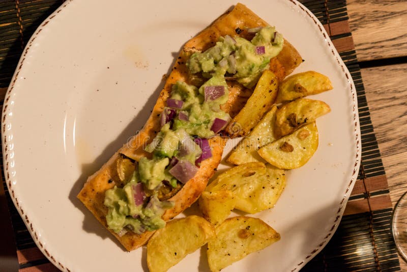 Salmon Fillet with Avocado in Plate at Dinner Table Stock Image - Image ...