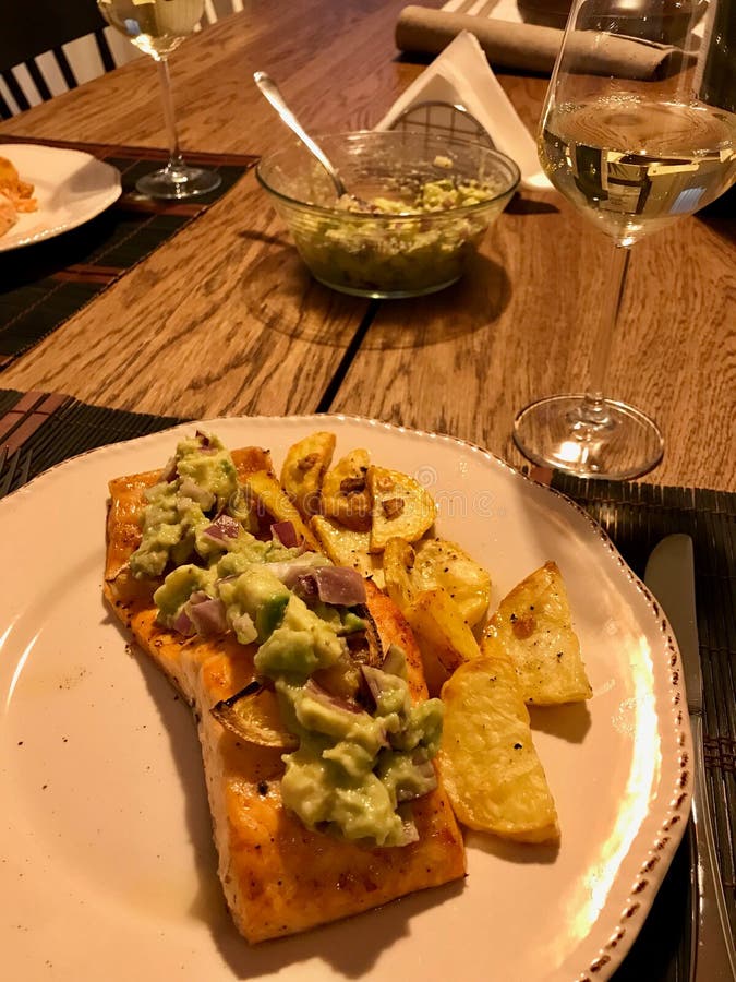 Salmon Fillet with Avocado in Plate at Dinner Table Stock Image - Image ...