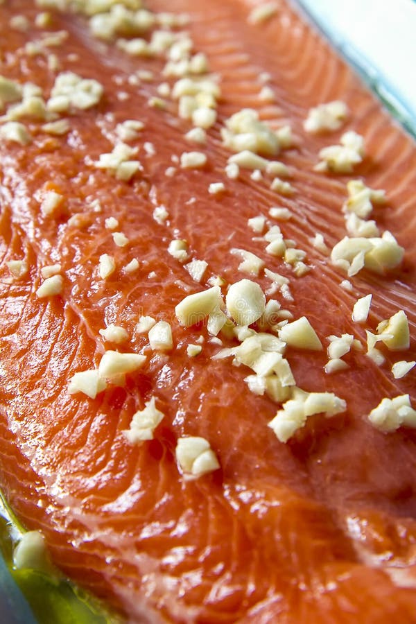 Salmon with Garlic Chunks Prepared for Grilling Stock Photo - Image of ...