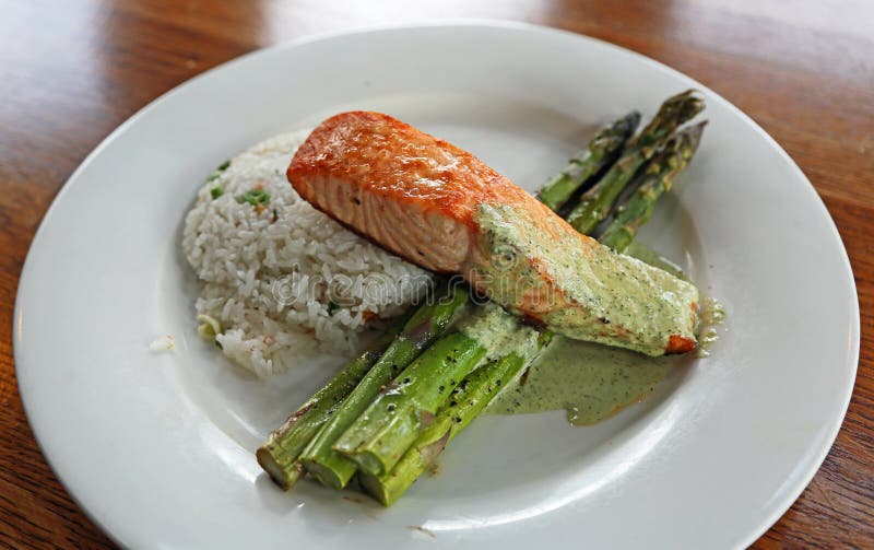 Salmon with Rice and Asparagus Stock Image - Image of baked, fish ...