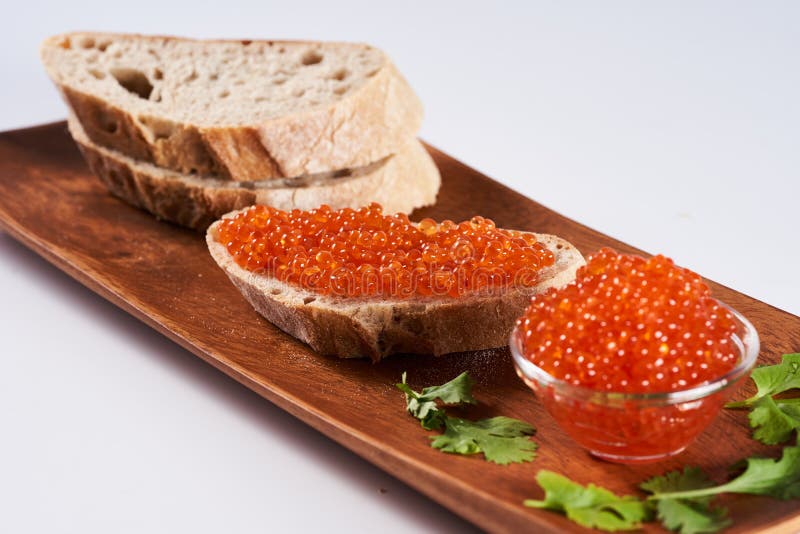 Salmon roe on bread stock photo. Image of appetizer - 228784164