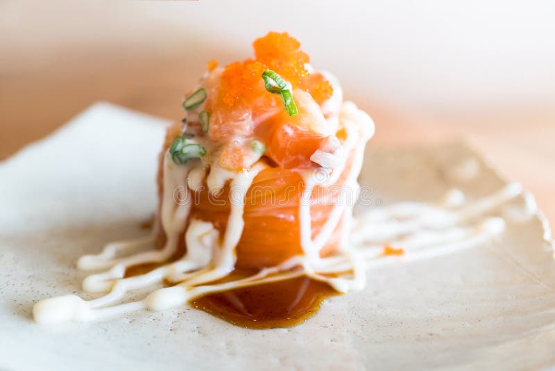 Salmon Sashimi Rolls with Cream and Flying Fish Roe Stock Photo - Image ...