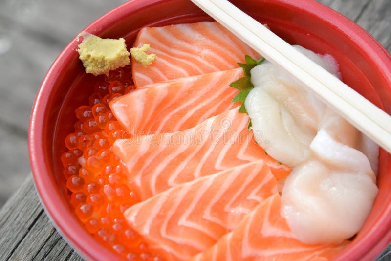 Salmon, Scallop and Fish Roe with Rice Stock Photo - Image of chopstick ...