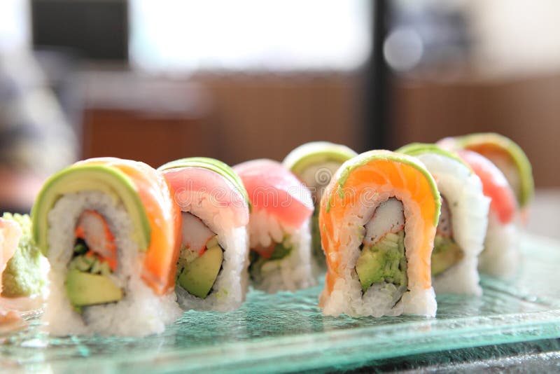 Salmon sushi rolls stock photo. Image of cream, avocado - 141552842