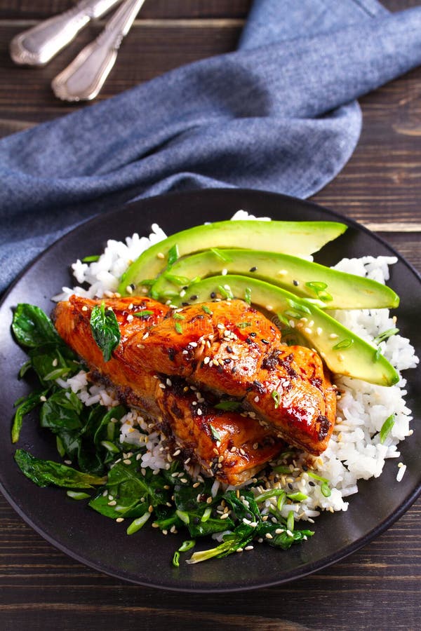 Salmon Teriyaki Rice Bowl with Spinach and Avocado. Stock Photo - Image ...