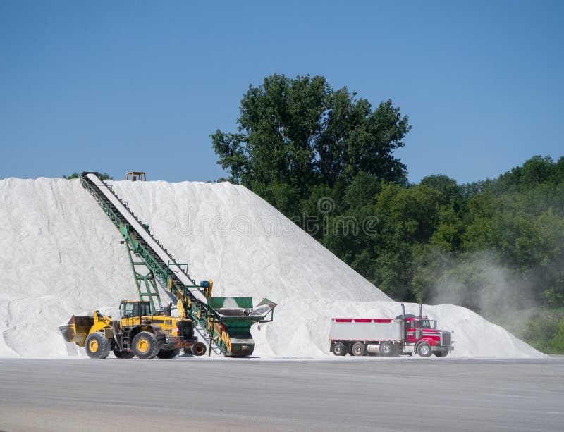 Salt being moved into Pile stock image. Image of excavator - 31652865