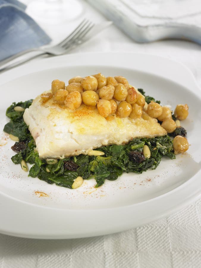 Salt-cod with Chickpeas,spinach and Pine Nuts Stock Image - Image of ...