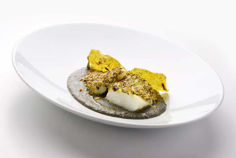 Salt Cod Crusted with Pistachios and Black Polenta Stock Image - Image ...
