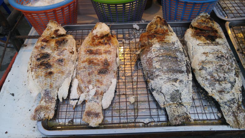 Salt-Crusted Grilled Fish Eaten with Seafood Sauce. Stock Image - Image ...