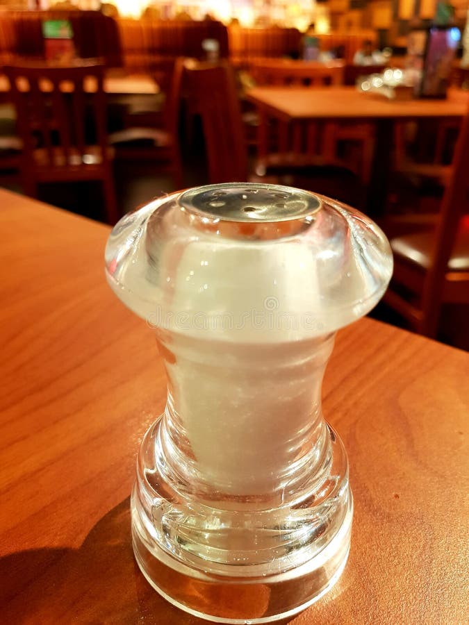 Salt in Designed Glass Bottle on the Table. Stock Image - Image of ...