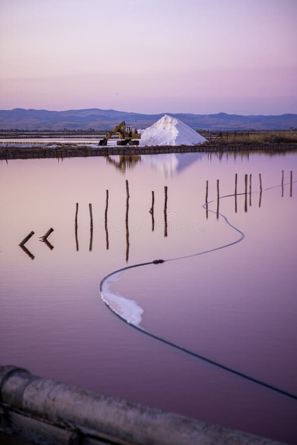Salt Farm Excavator with Sunset and a Salt Mountain Stock Photo - Image ...