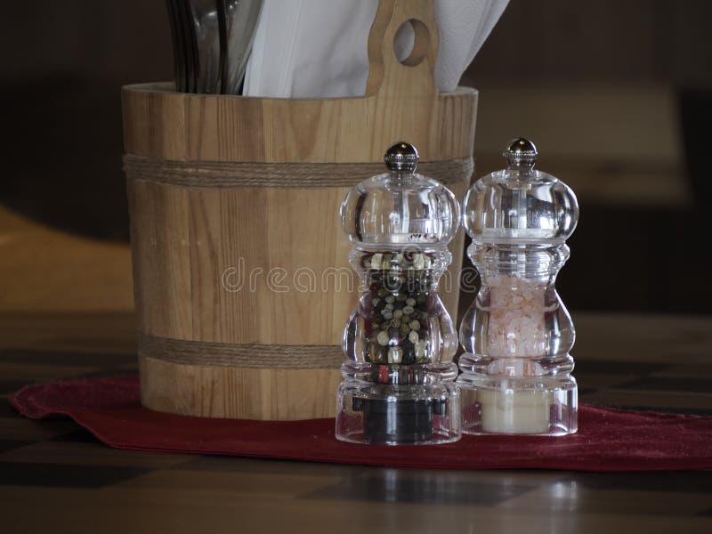 Salt and Pepper Grinders on the Table Stock Photo - Image of container ...
