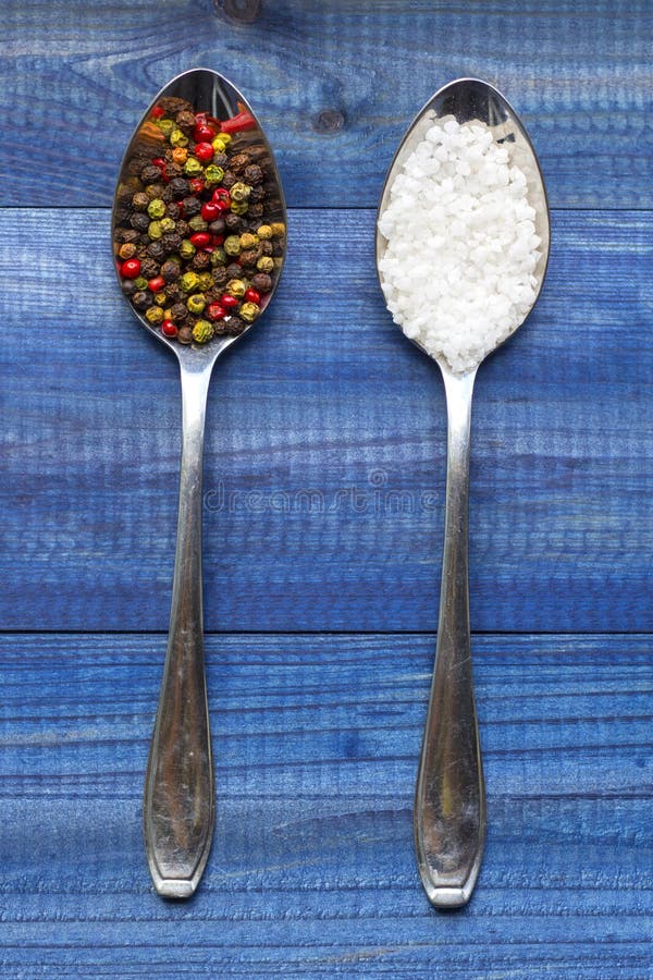 Salt and Pepper on Metal Spoons Stock Photo - Image of food, salt: 87698700