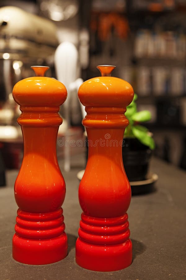 Salt and Pepper Mill in Orange Color on Table Stock Image - Image of ...