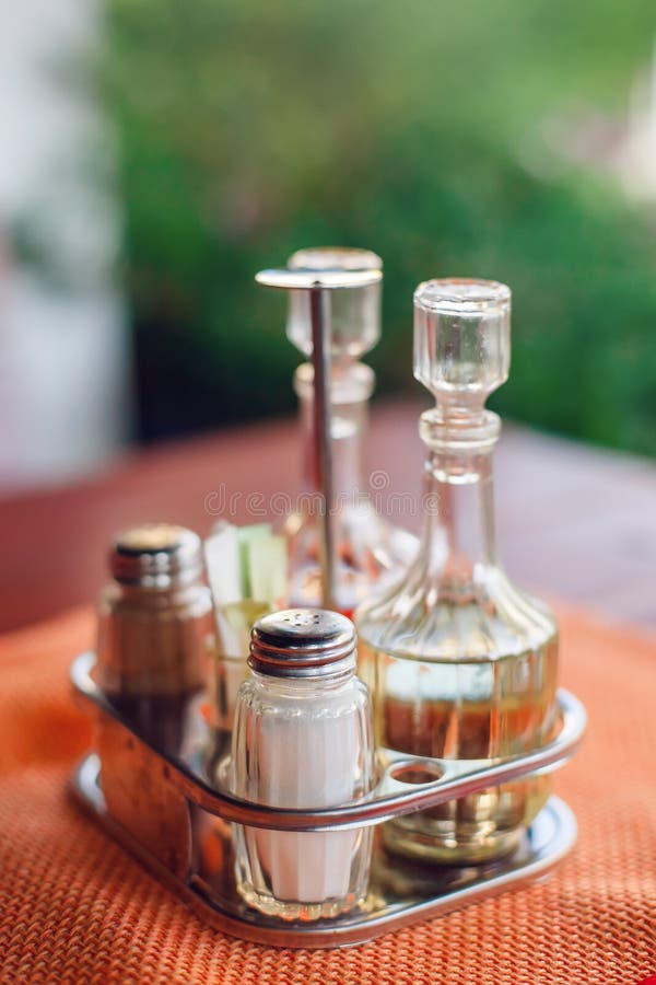 Salt, Pepper, Olive Oil and Vinegar. Condiments in Restaurant, Closeup ...