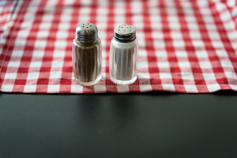 Salt and Pepper on Red and White Plaid Dish Towel Stock Photo - Image ...
