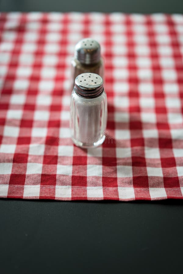 Salt and Pepper on Red and White Plaid Dish Towel Stock Image - Image ...