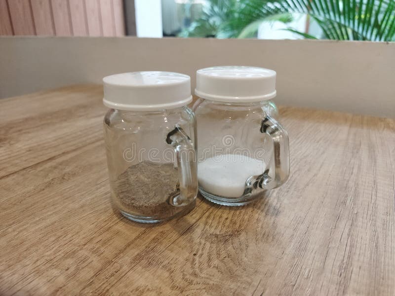 Salt and Pepper Setting on Restaurant Table Stock Photo - Image of ...