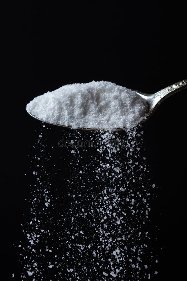 Salt is Poured from a Salt Shaker on a Black Background Stock Image ...