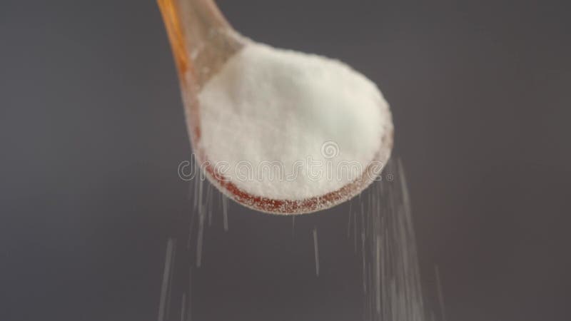 Salt pouring from a spoon stock footage. Video of pourer - 368163258
