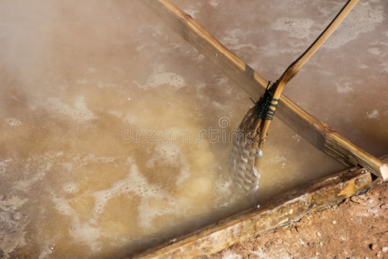 Salt production by boiling stock image. Image of ponds - 108022817