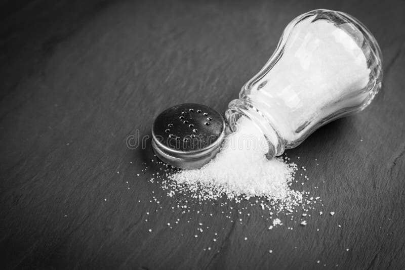 Salt shaker on slate board stock photo. Image of salt - 74814560