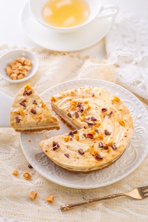 Salted Caramel Cheesecake with Cup of Tea Stock Photo - Image of pastry ...