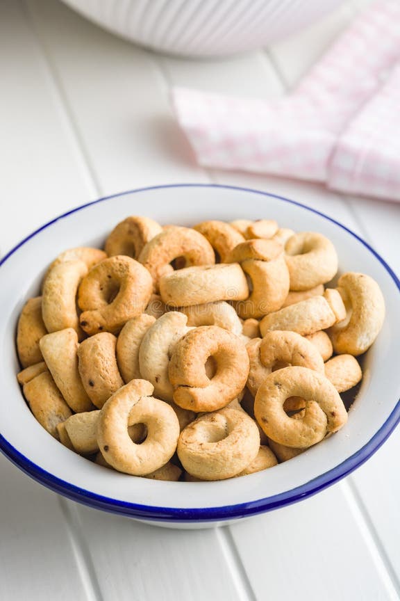 Salted Crispy Snack Rings in Bowl on Kitchen Table Stock Image - Image ...