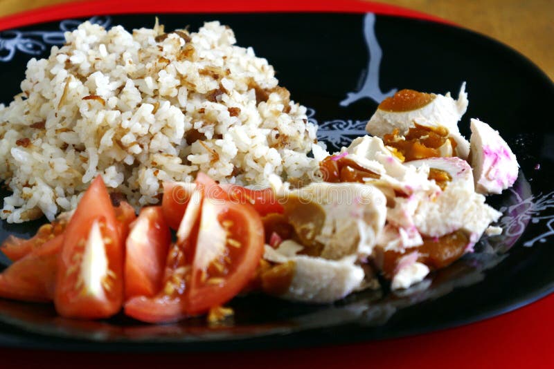 Salted Duck Egg, Sliced Tomato and Fried Rice on a Plate Stock Image ...