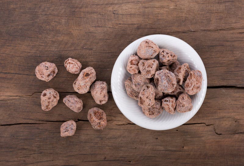 Salted Plum on Wooden Background Stock Image - Image of exotic, closeup ...